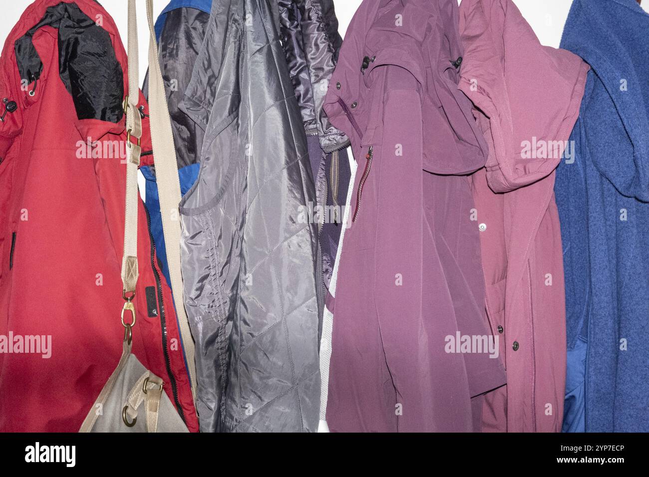 Hanging up coats hi-res stock photography and images - Alamy