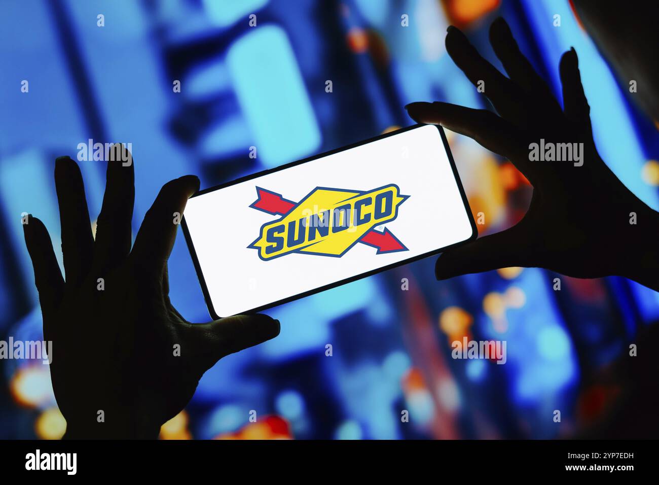 In this photo illustration, the Sunoco logo is displayed on a ...