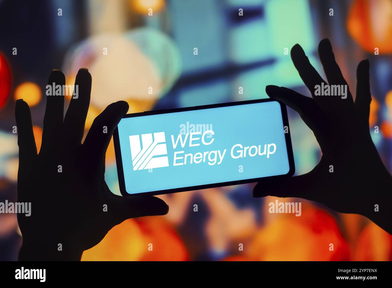 In this photo illustration, the WEC Energy Group logo is displayed on a ...