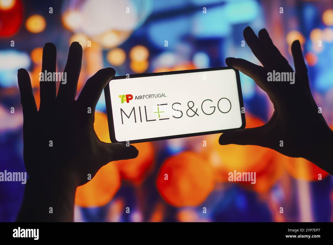 In this photo illustration, the TAP Miles and Go logo is displayed on a ...
