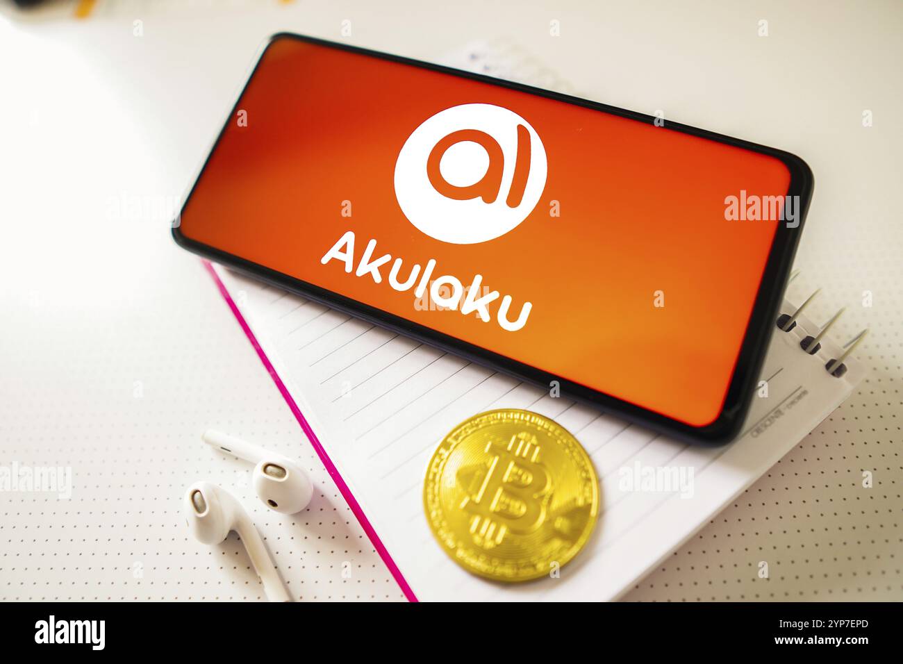 In this photo illustration, the Akulaku logo is displayed on a ...