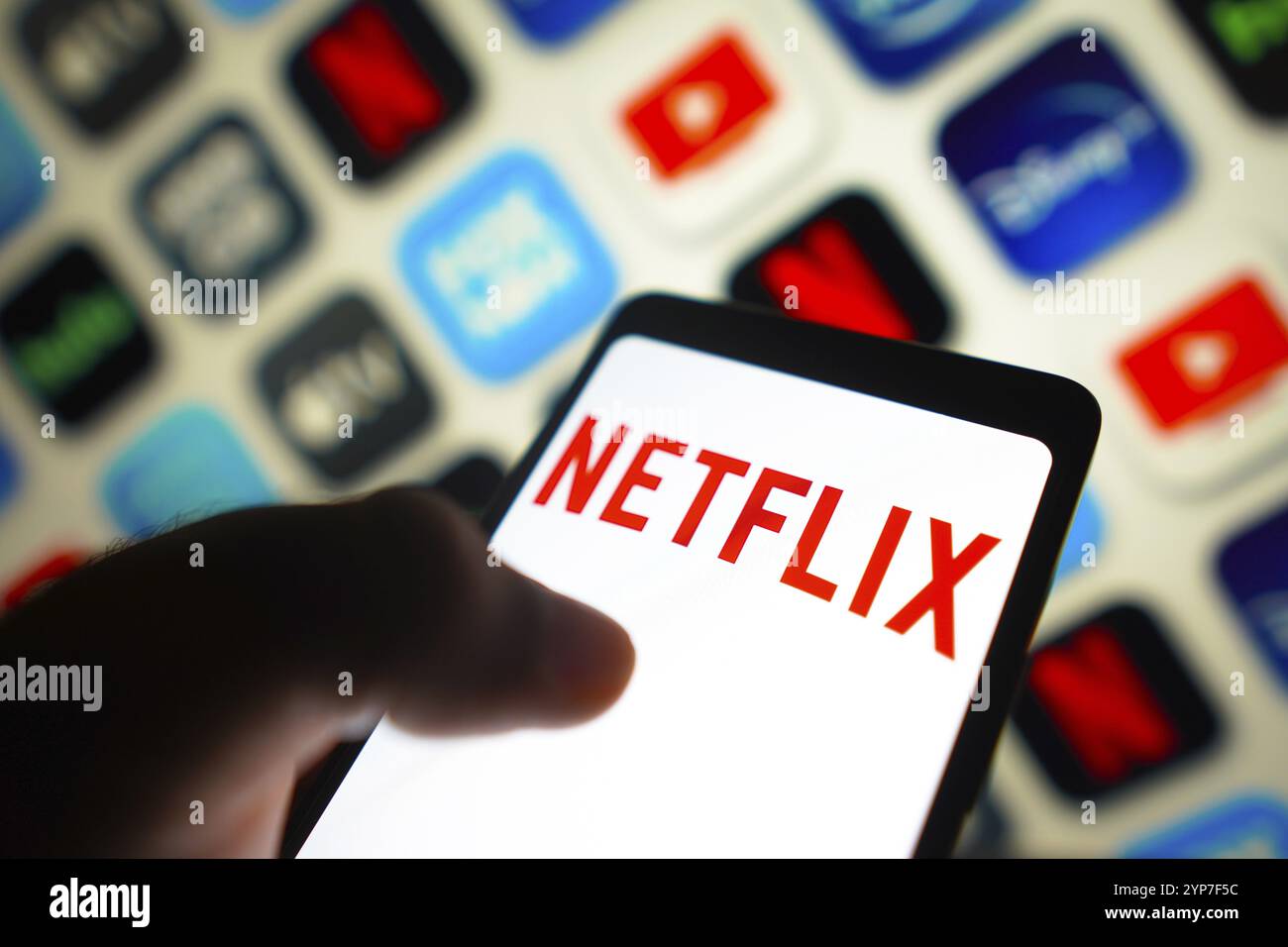 In this photo illustration, the Netflix logo is displayed on a ...