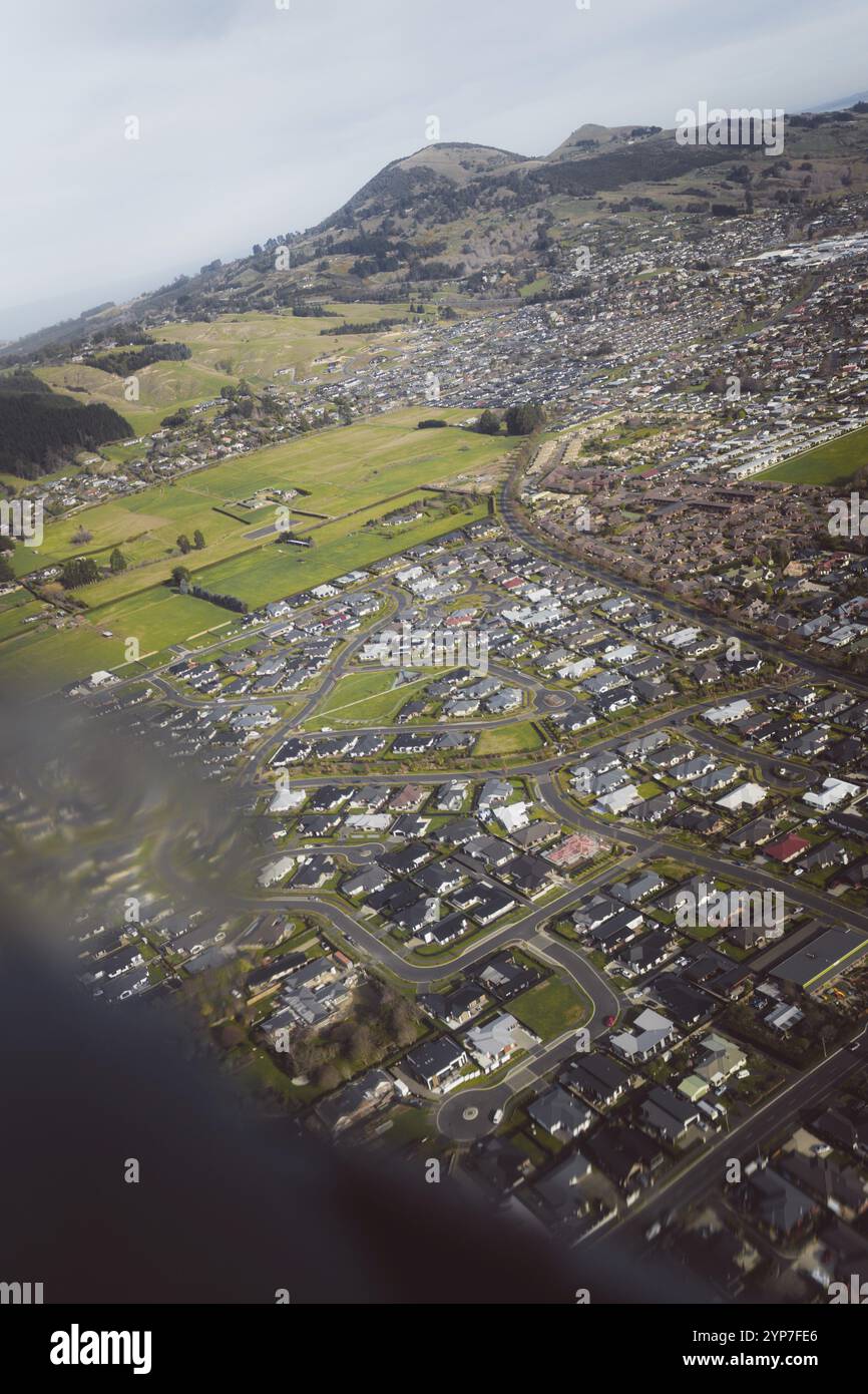 Aerial view of an urban landscape with fields and houses, Dunedin, New ...