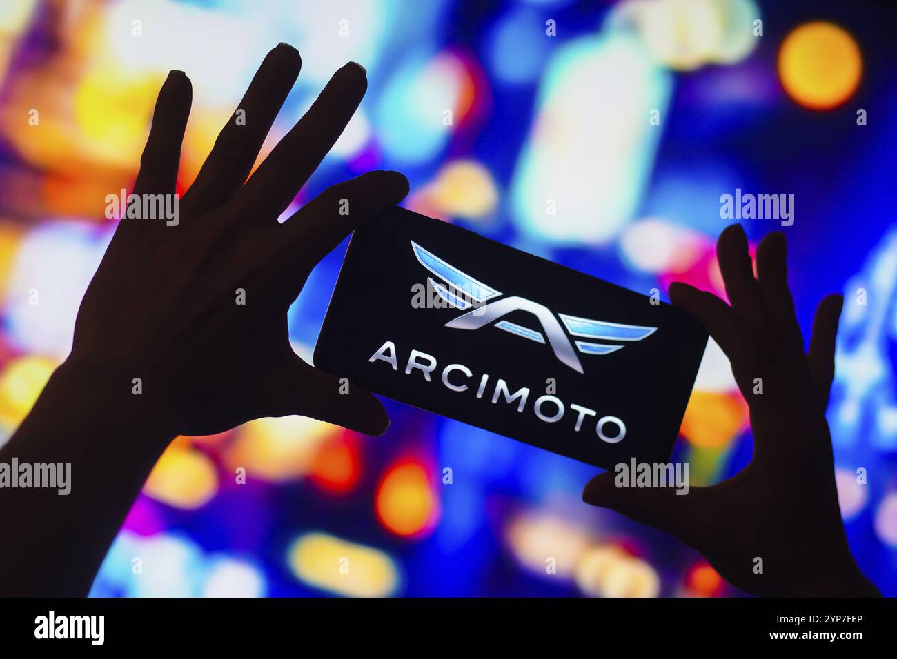 In this photo illustration, the Arcimoto logo is displayed on a ...
