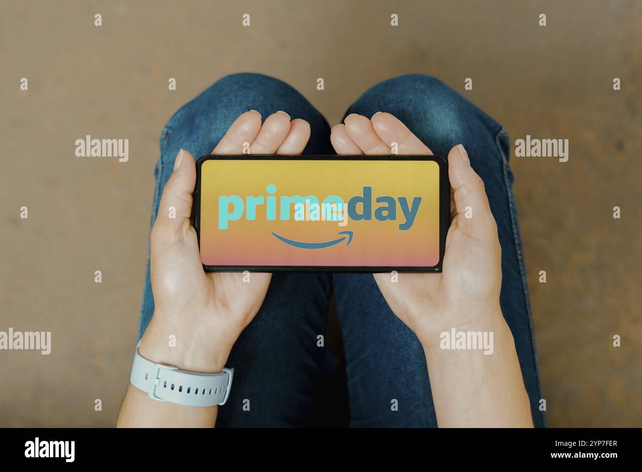 In this photo illustration, the Amazon Prime Day logo is displayed on a smartphone screen Stock ...