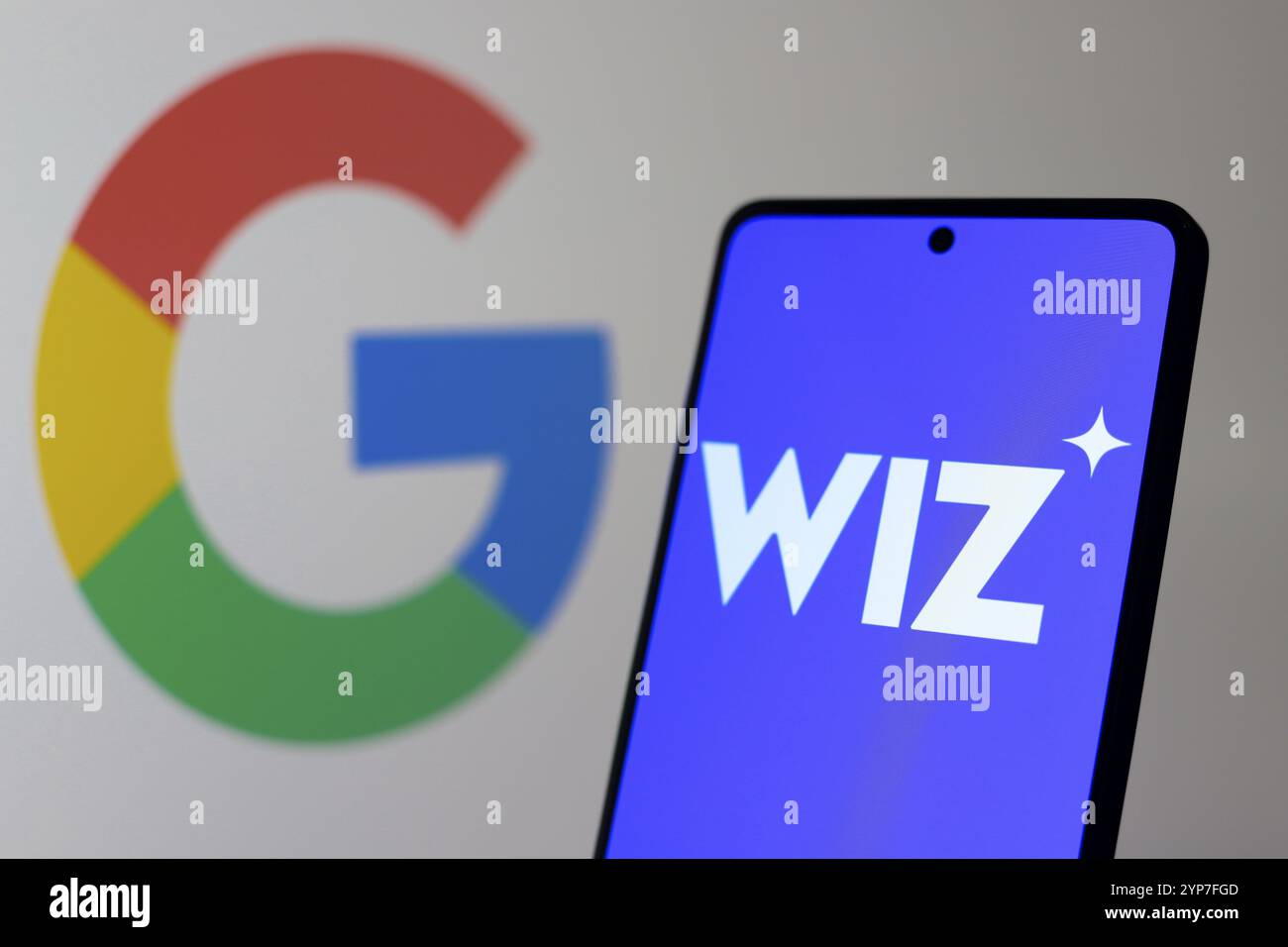 In this photo illustration, the Wiz logo seen displayed on a smartphone ...