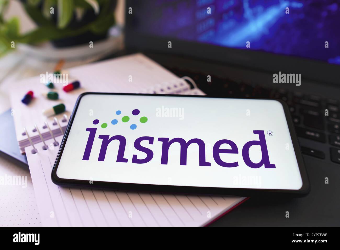 In this photo illustration, the Insmed logo is displayed on a ...