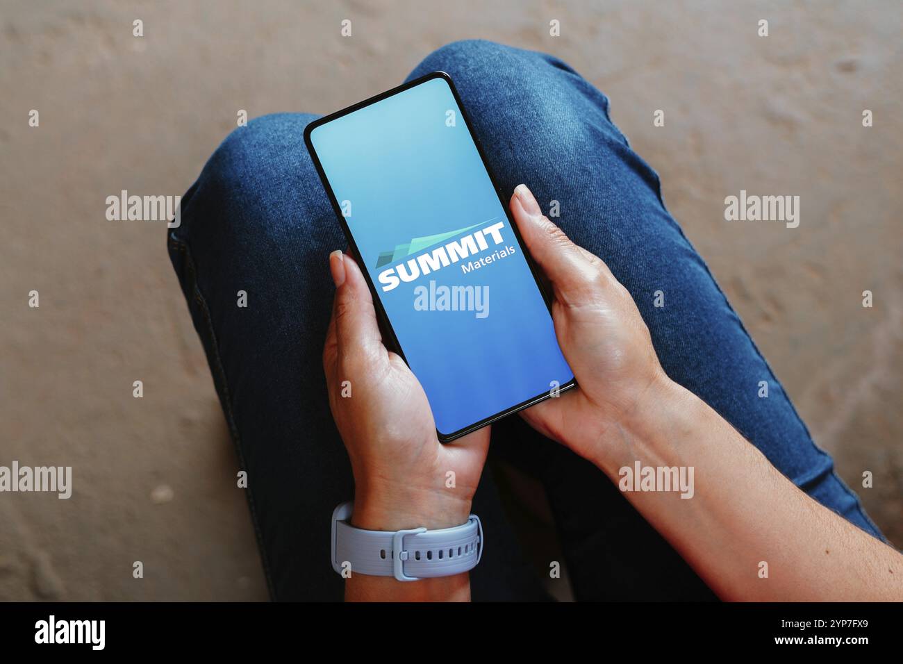 In this photo illustration, the Summit Materials logo is displayed on a ...