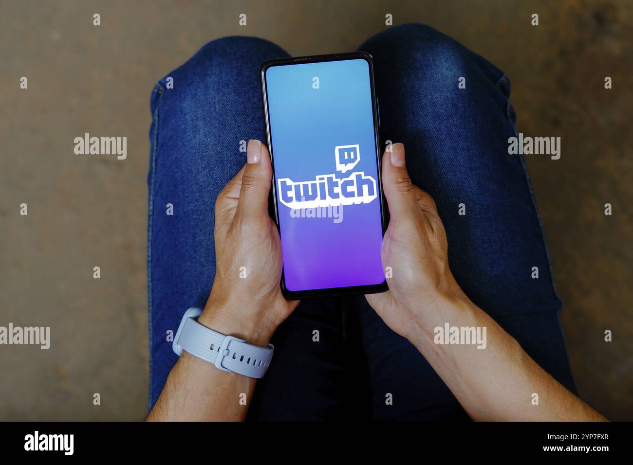 In this photo illustration, the Twitch logo is displayed on a ...