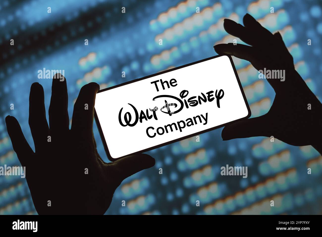 In this photo illustration, the Walt Disney Company logo is displayed ...