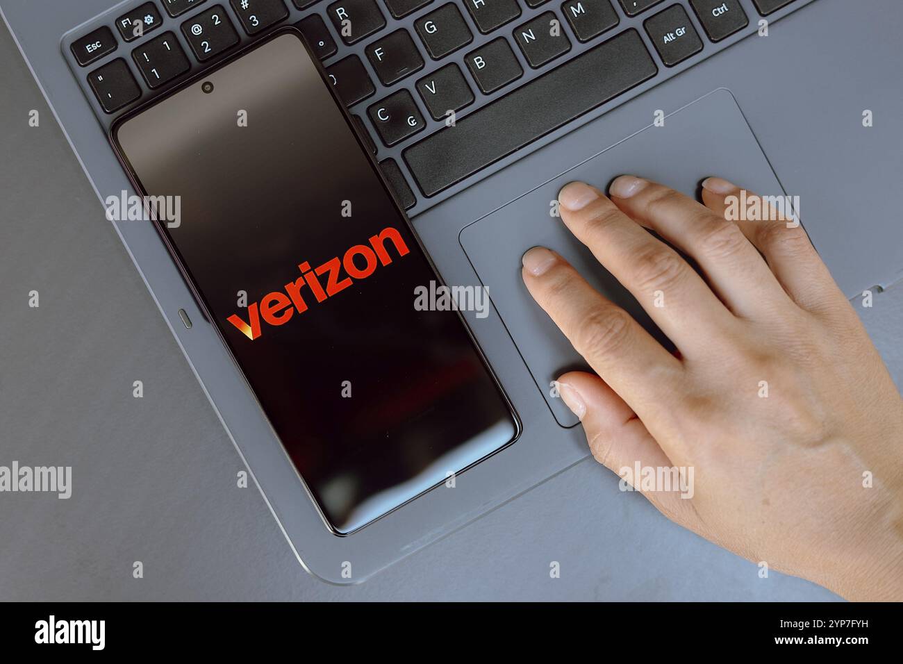 In this photo illustration, the Verizon Communications logo is ...