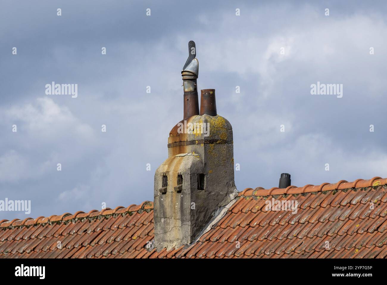 Chimney on a roof with clay tiles Stock Photo - Alamy