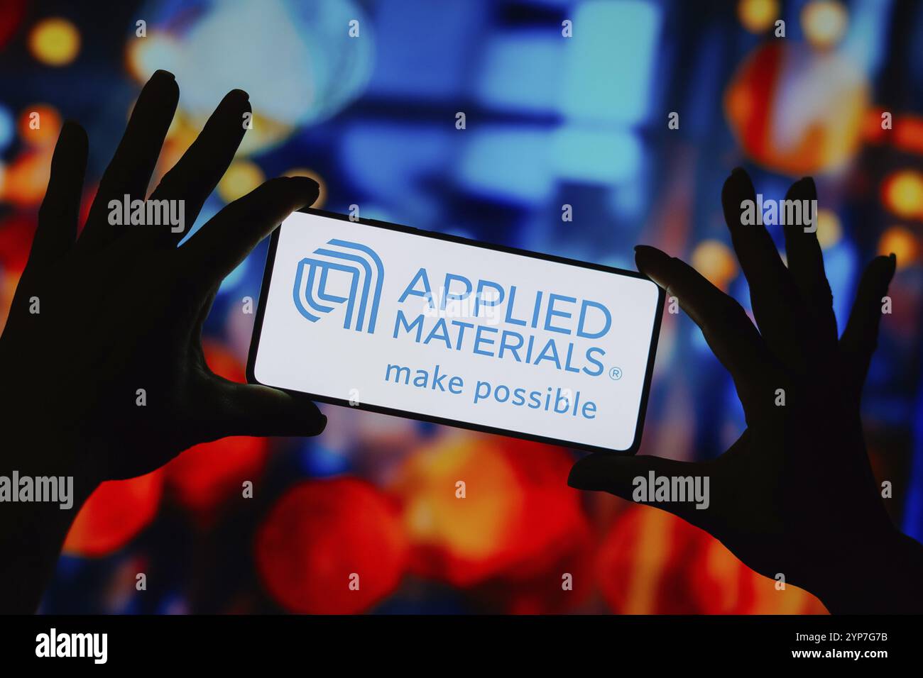 In this photo illustration, the Applied Materials logo is displayed on ...