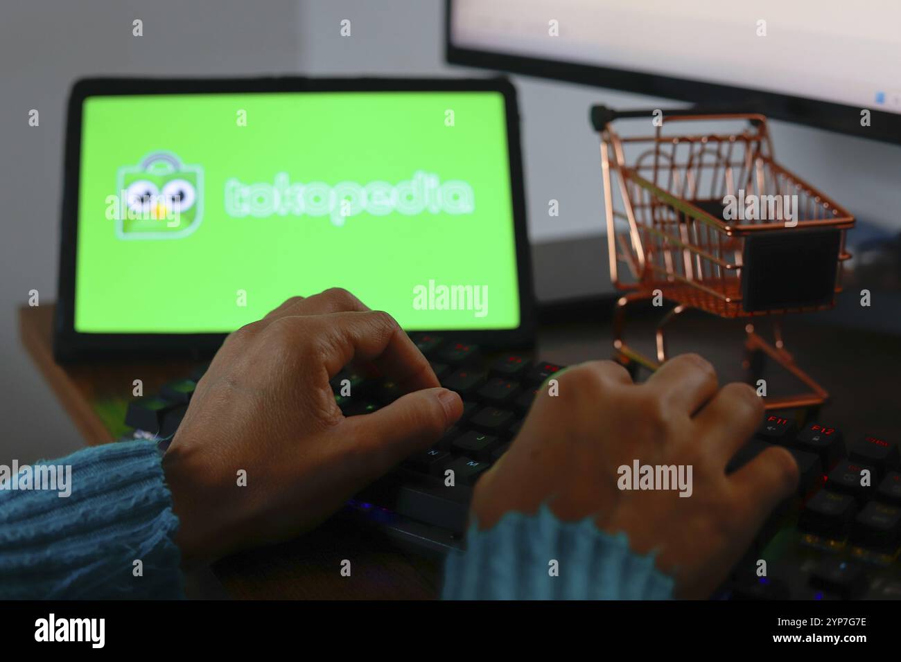 In this photo illustration, a person typing and in the background the ...