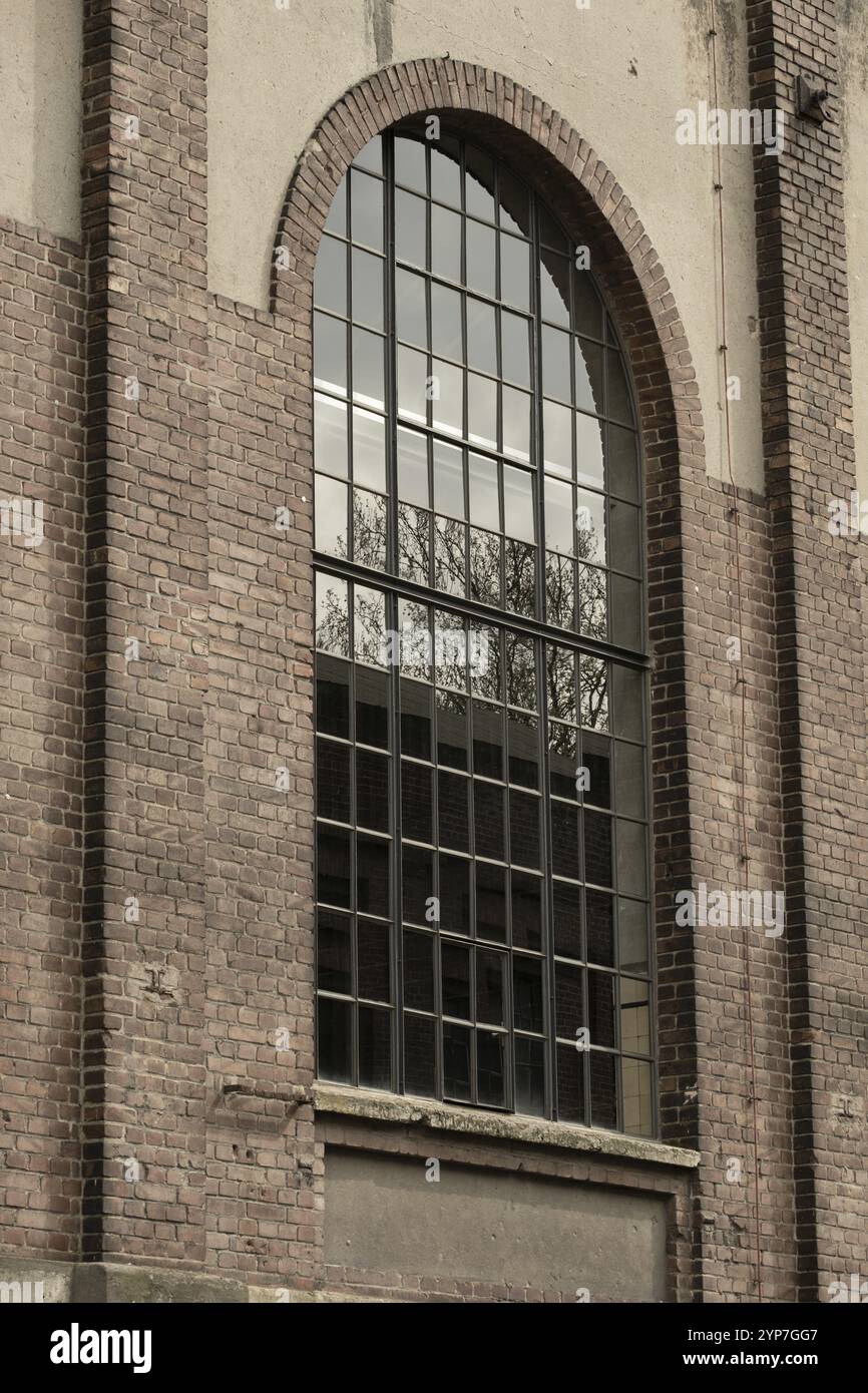 Details of an old industrial building, brick wall and windows, approx ...