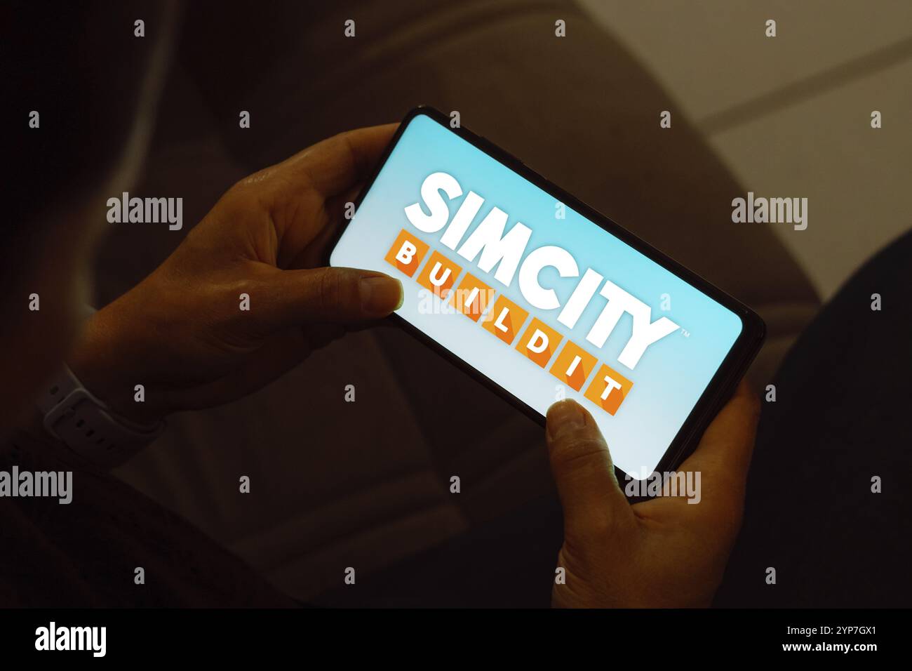 In this photo illustration, the SimCity BuildIt logo is displayed on a ...