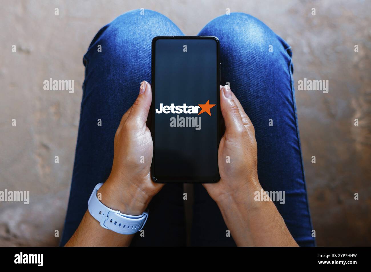 In this photo illustration, the Jetstar Airways logo is displayed on a ...