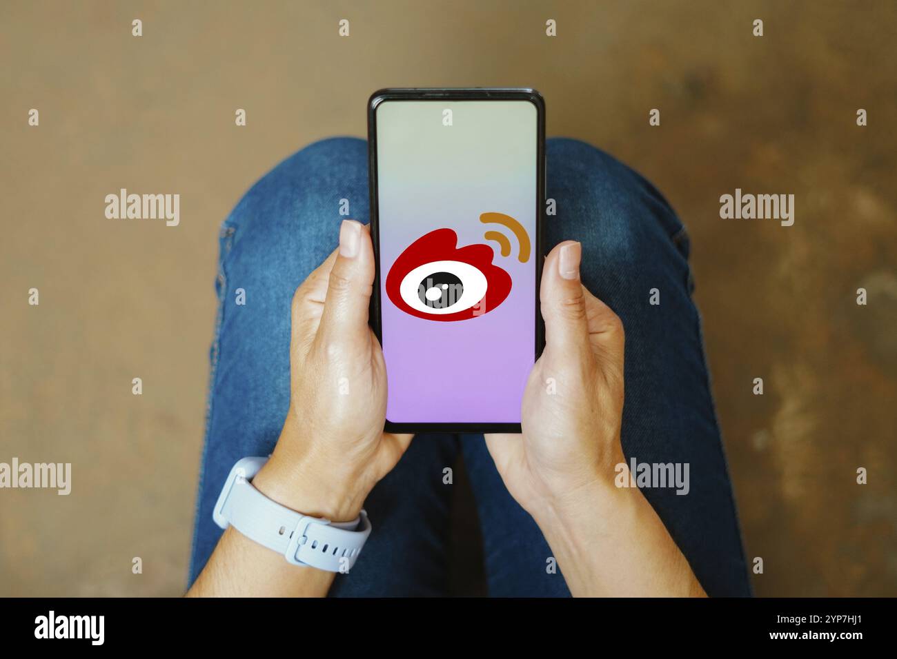 In this photo illustration, the Sina Weibo logo seen displayed on a smartphone Stock Photo - Alamy