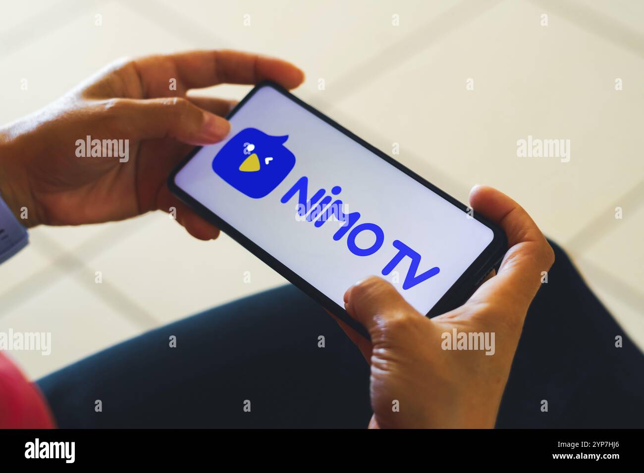 In this photo illustration, the Nimo TV logo is displayed on a ...