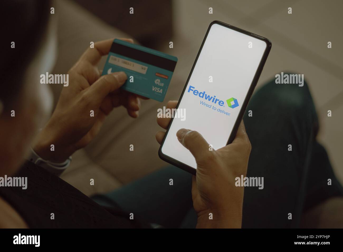 In this photo illustration, the Fedwire logo seen displayed on a ...