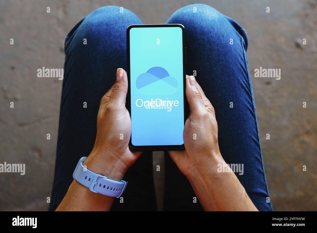 In this photo illustration, the OneDrive logo is displayed on a ...