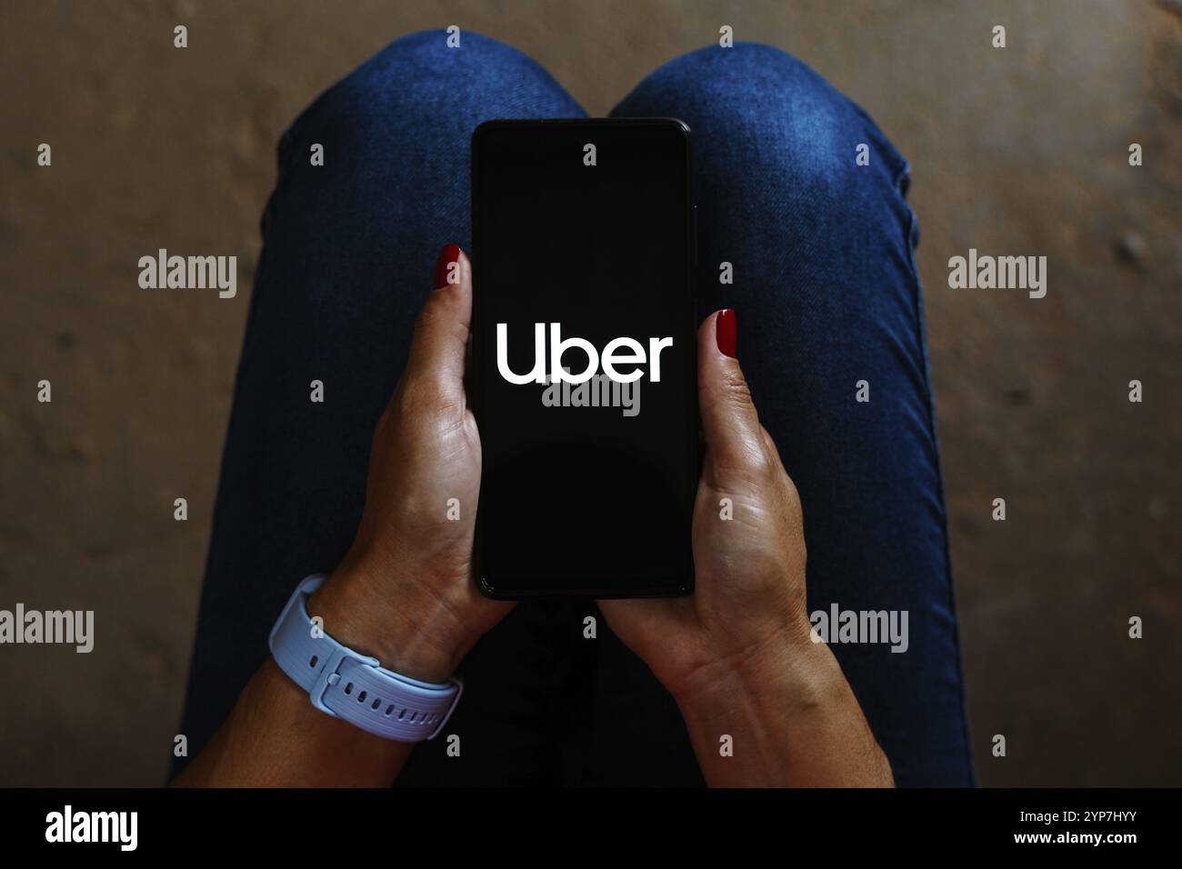 In this photo illustration, the Uber logo is displayed on a smartphone ...
