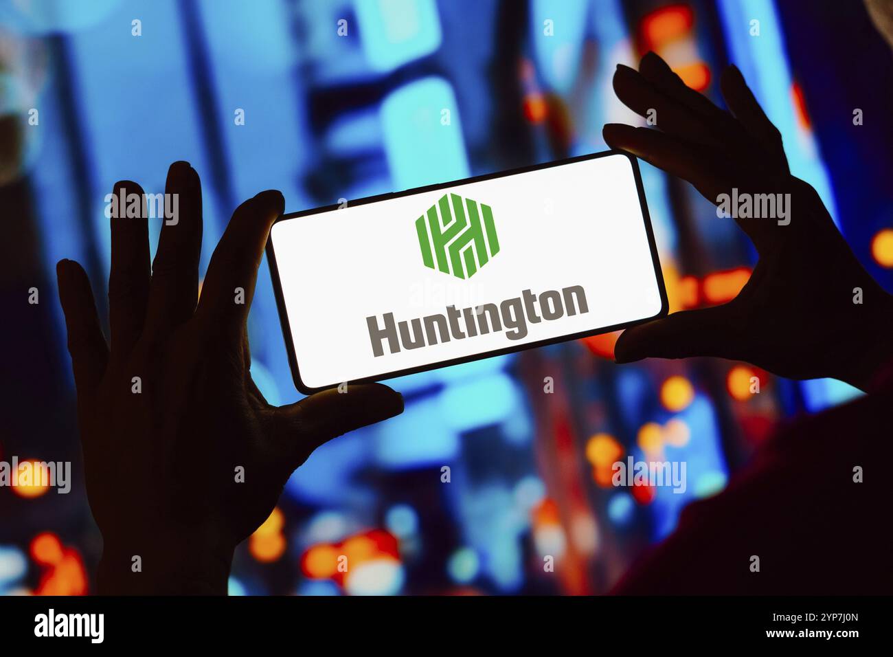 In this photo illustration, the Huntington Bank logo is displayed on a ...
