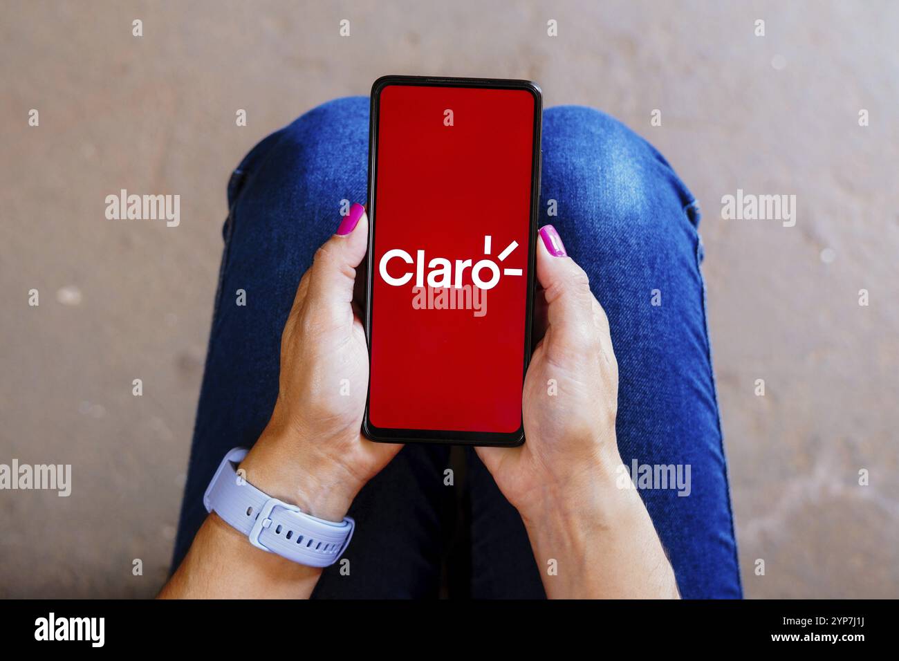 In this photo illustration, the Claro logo is displayed on a smartphone ...