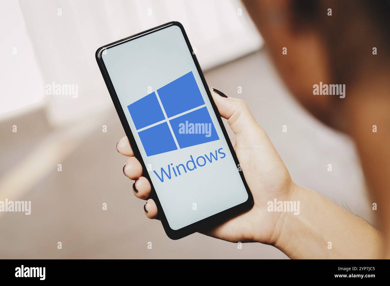 In this photo illustration, the Microsoft Windows logo is displayed on ...