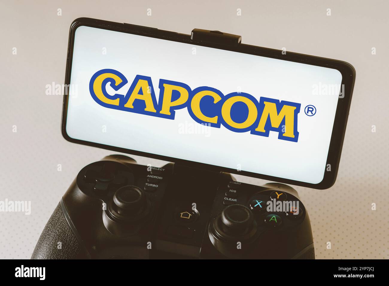 In this photo illustration, the Capcom logo displayed on a smartphone ...
