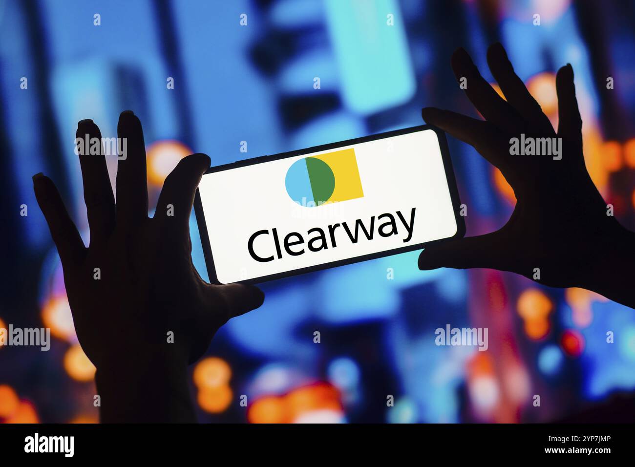 In this photo illustration, the Clearway Energy logo is displayed on a ...