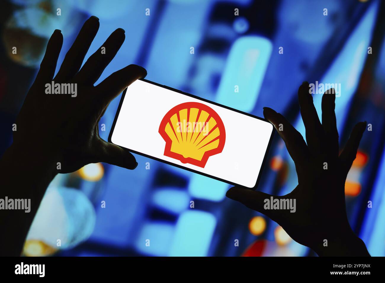 In this photo illustration, the Shell logo is displayed on a smartphone ...