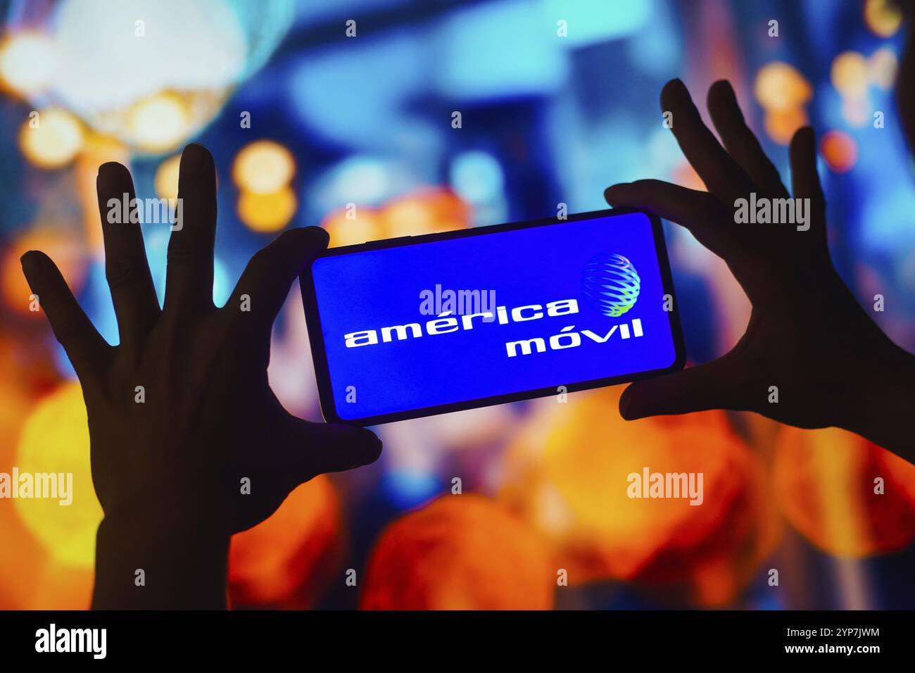 In this photo illustration, the America Movil logo is displayed on a ...
