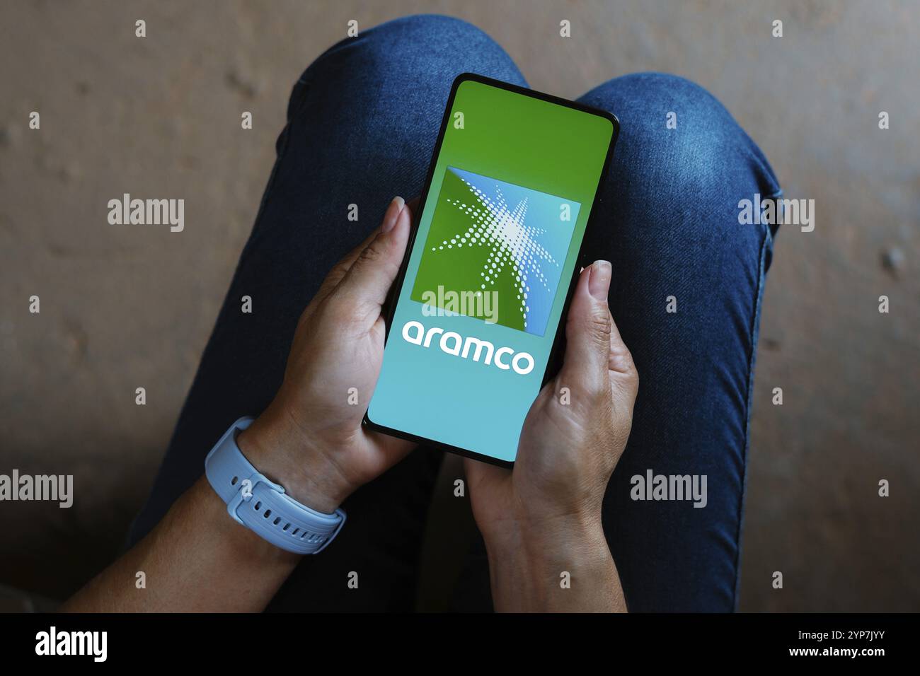 In this photo illustration, the Saudi Aramco logo is displayed on a ...