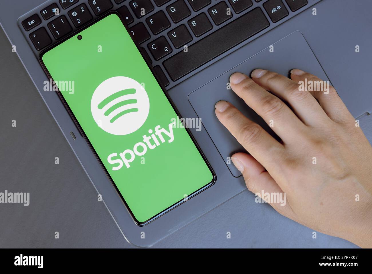 In this photo illustration, the Spotify logo is displayed on a ...