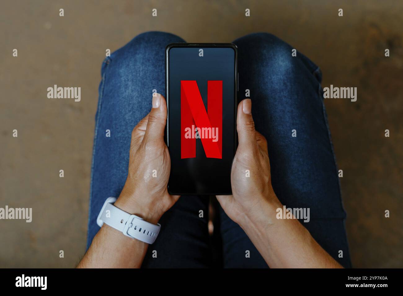In this photo illustration, the Netflix logo is displayed on a ...