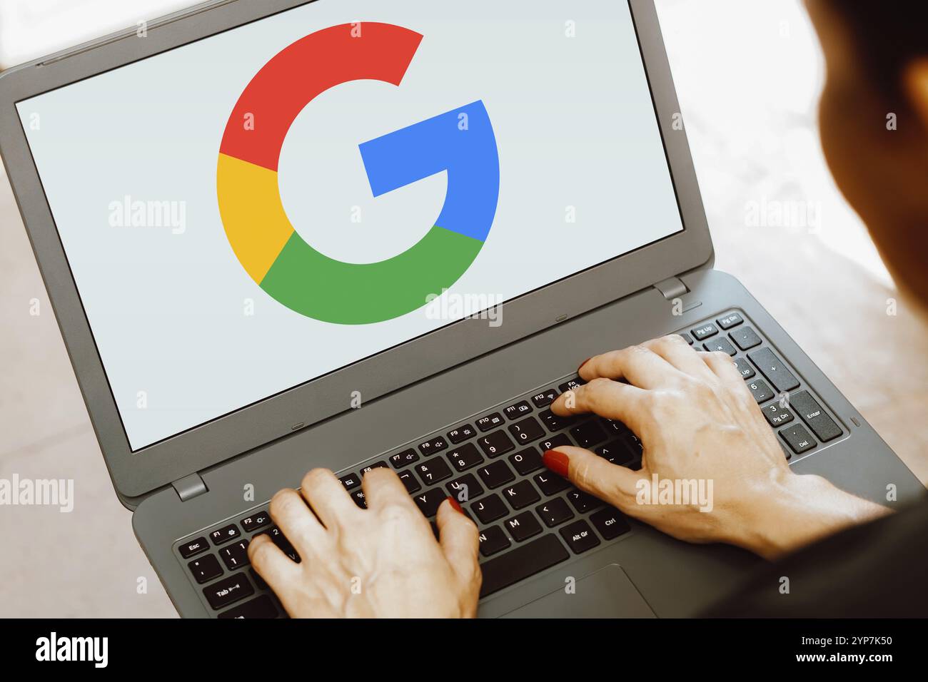 In this photo illustration, the Google logo is displayed on a notebook ...
