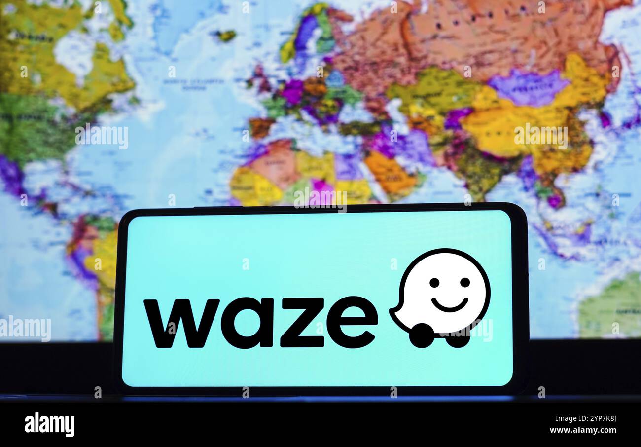 In this photo illustration the Waze logo seen displayed on a smartphone ...