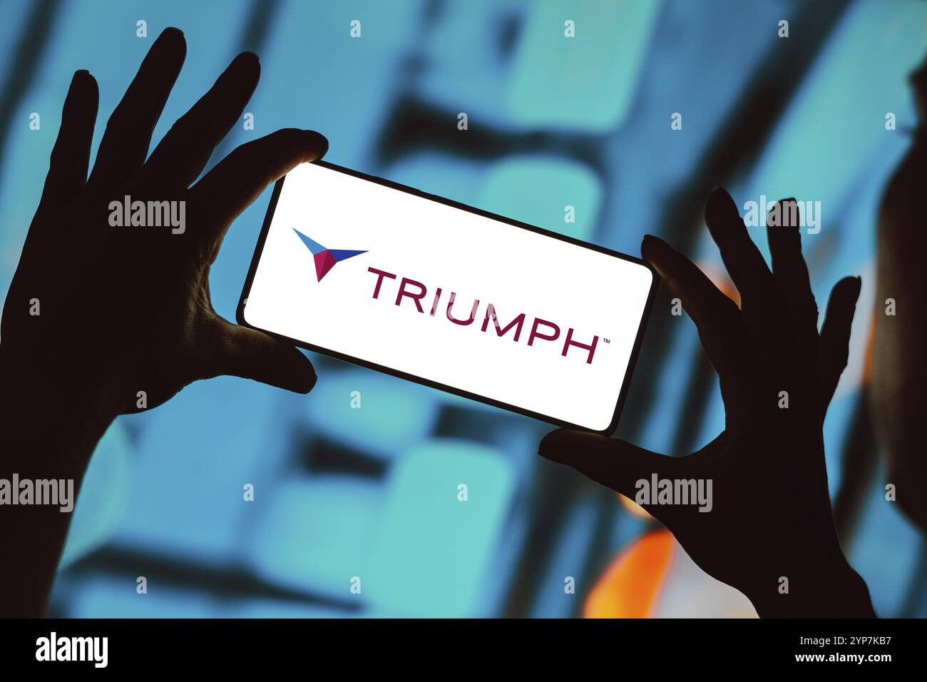 In this photo illustration, the Triumph Group logo is displayed on a ...