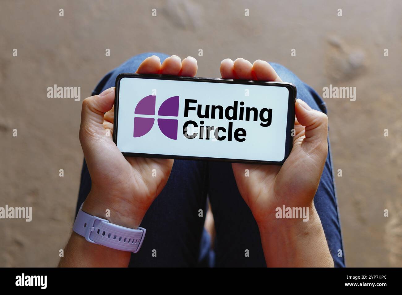 In this photo illustration, the Funding Circle logo is displayed on a smartphone screen Stock ...