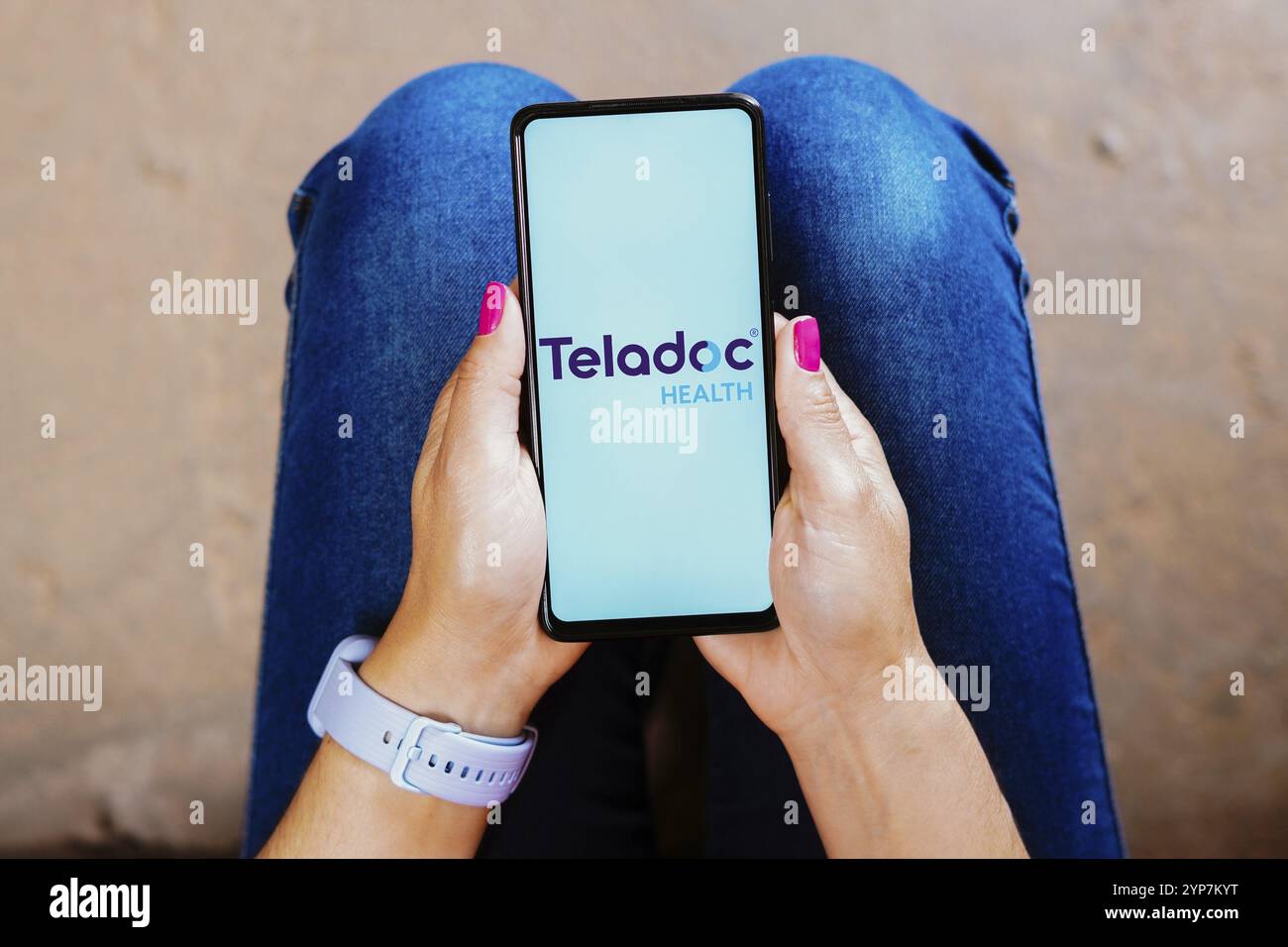 In this photo illustration, the Teladoc Health logo seen displayed on a ...
