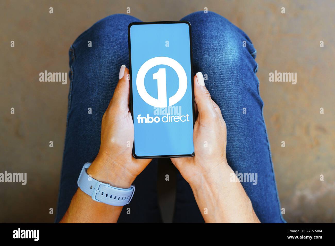 In this photo illustration, the FNBO Direct logo is displayed on a ...