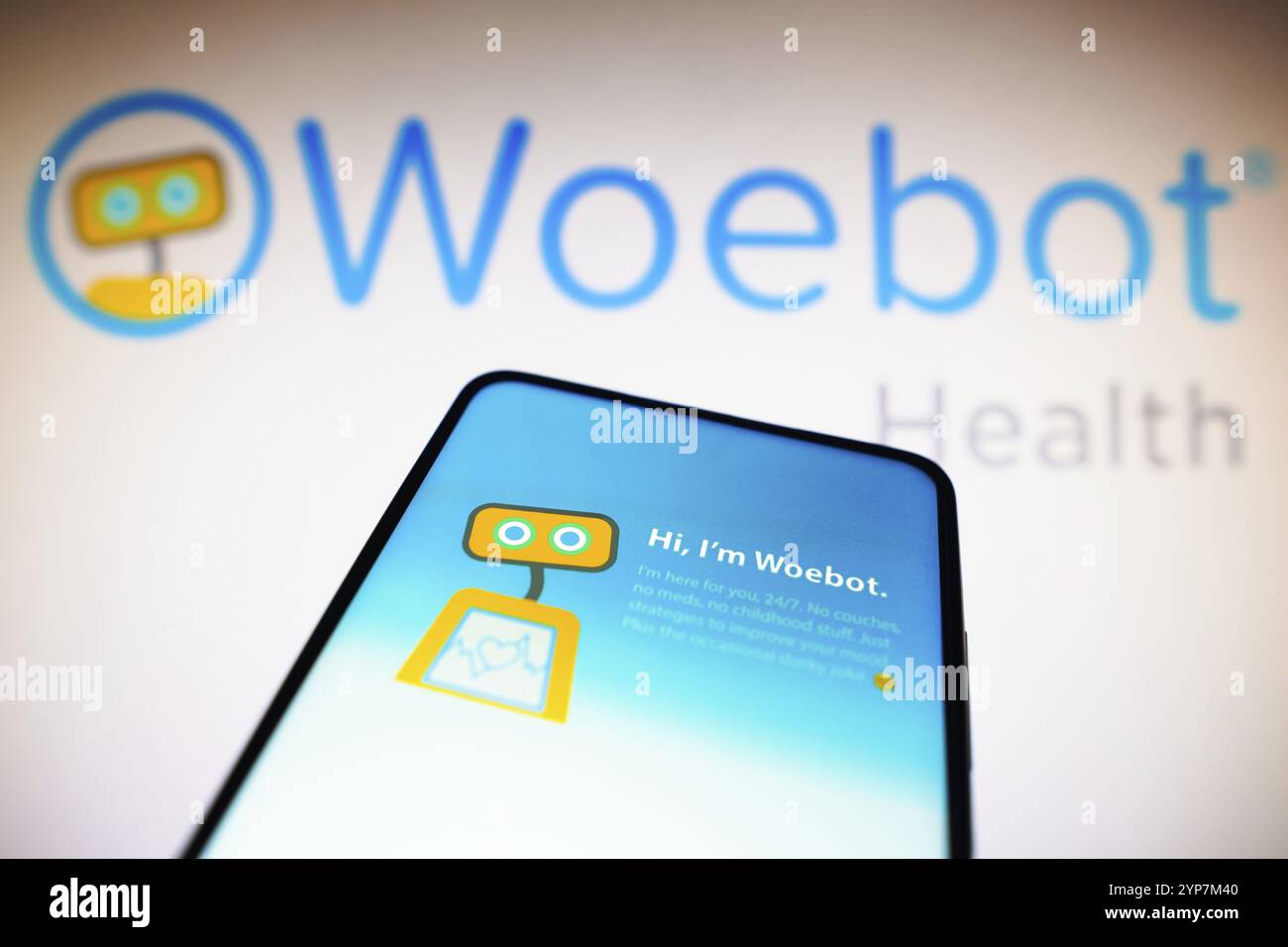 In this photo illustration, the Woebot Health logo is seen displayed on a smartphone Stock Photo ...