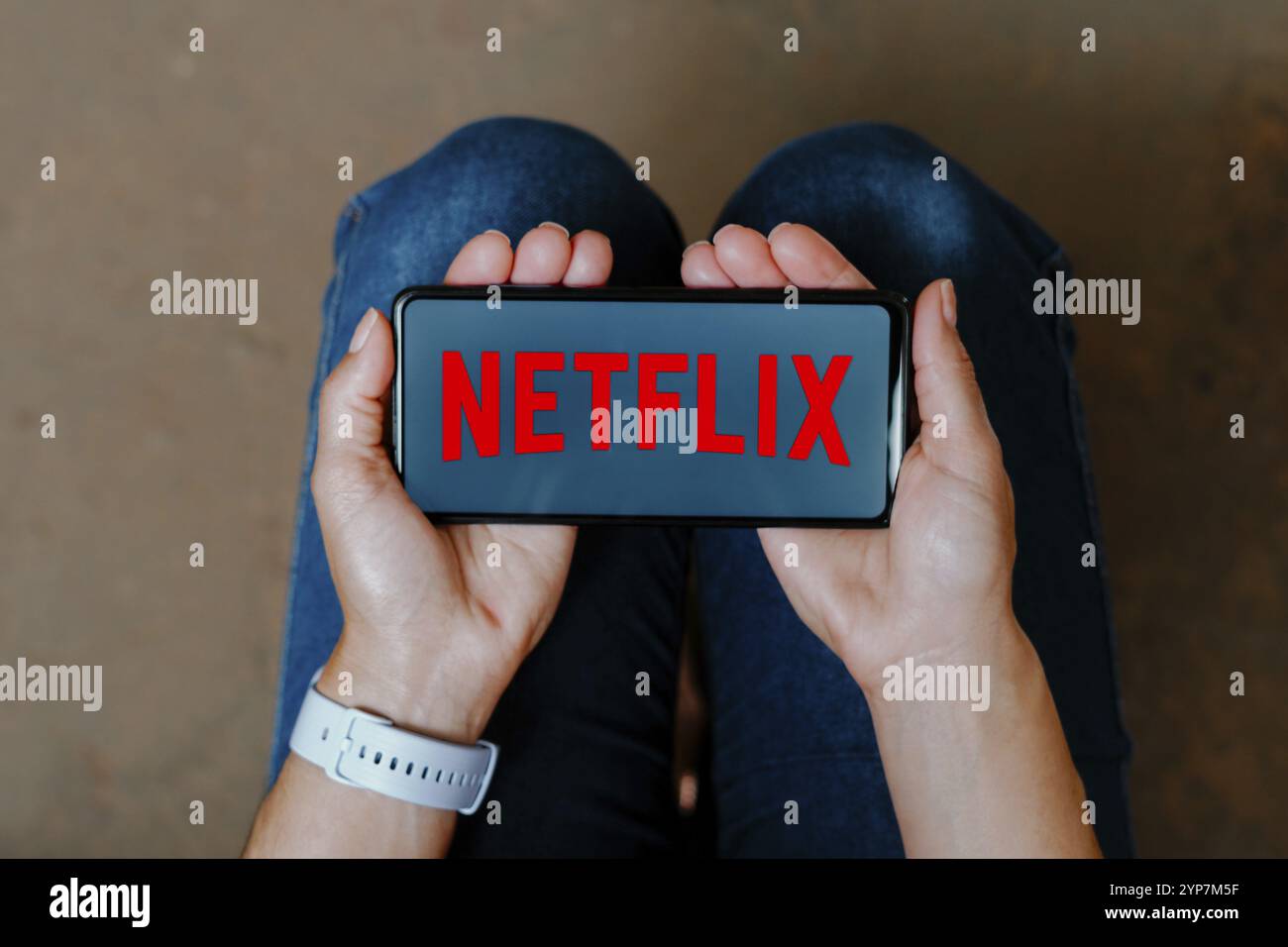 In this photo illustration, the Netflix logo is displayed on a ...