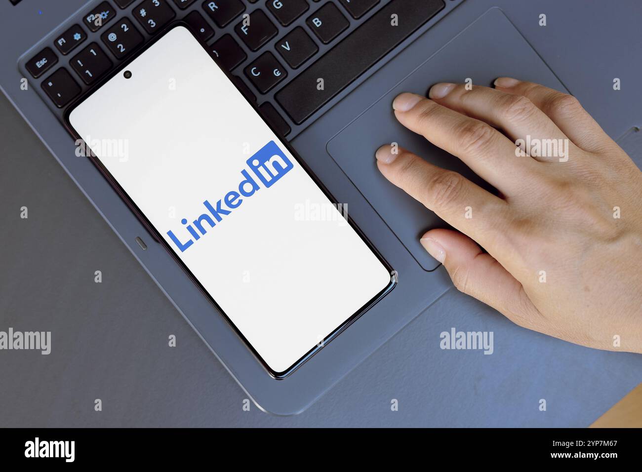 In this photo illustration, the LinkedIn logo is displayed on a ...