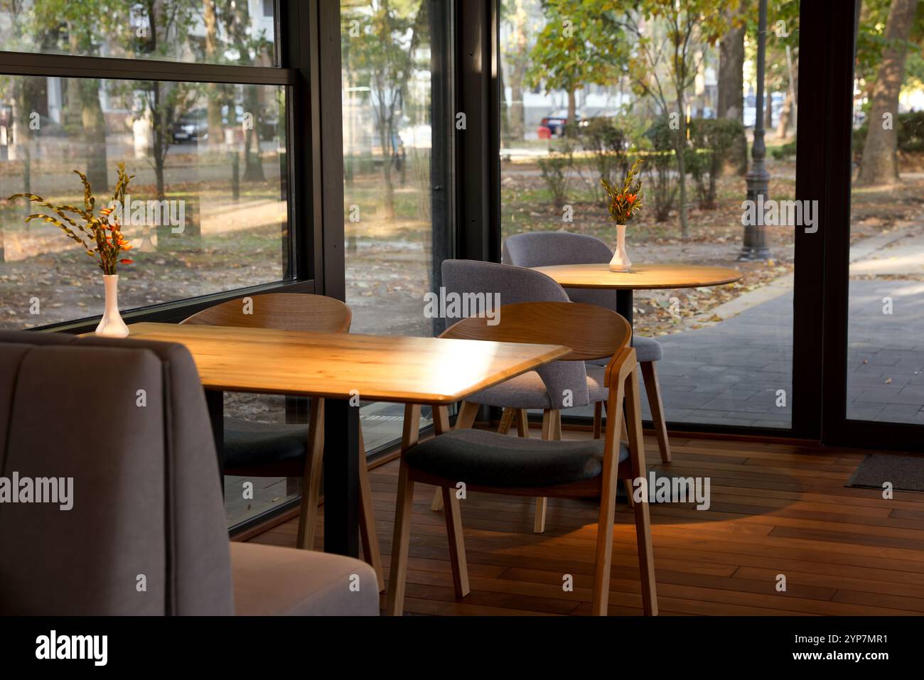 Stylish cafe with large windows. Interior design Stock Photo - Alamy