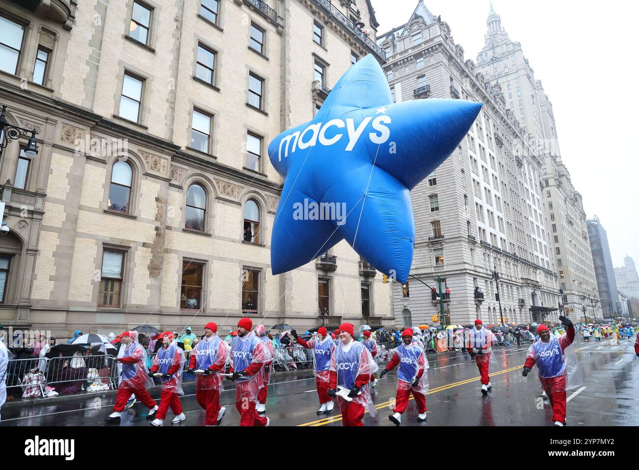The Macy's Blue Star heads down Central Park West during The 98th Macy ...