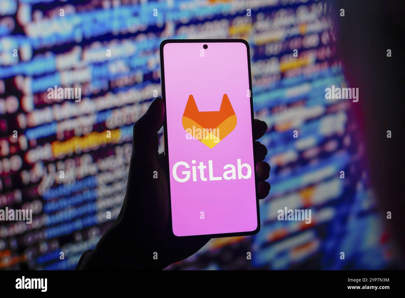 In this photo illustration, the GitLab logo is displayed on a ...