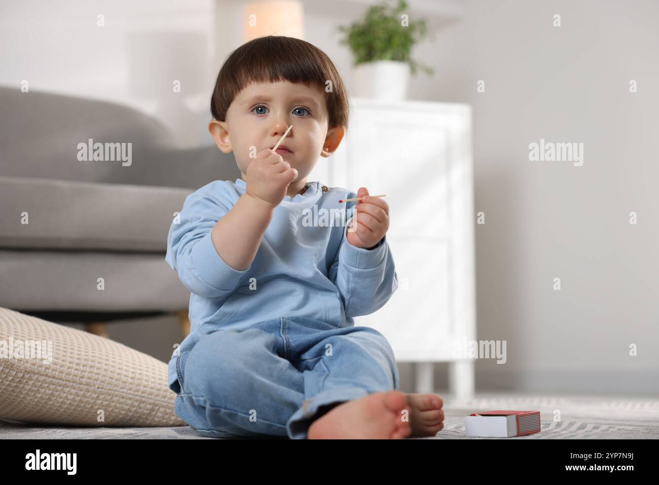 Little boy playing with matches at home. Child in danger Stock Photo ...