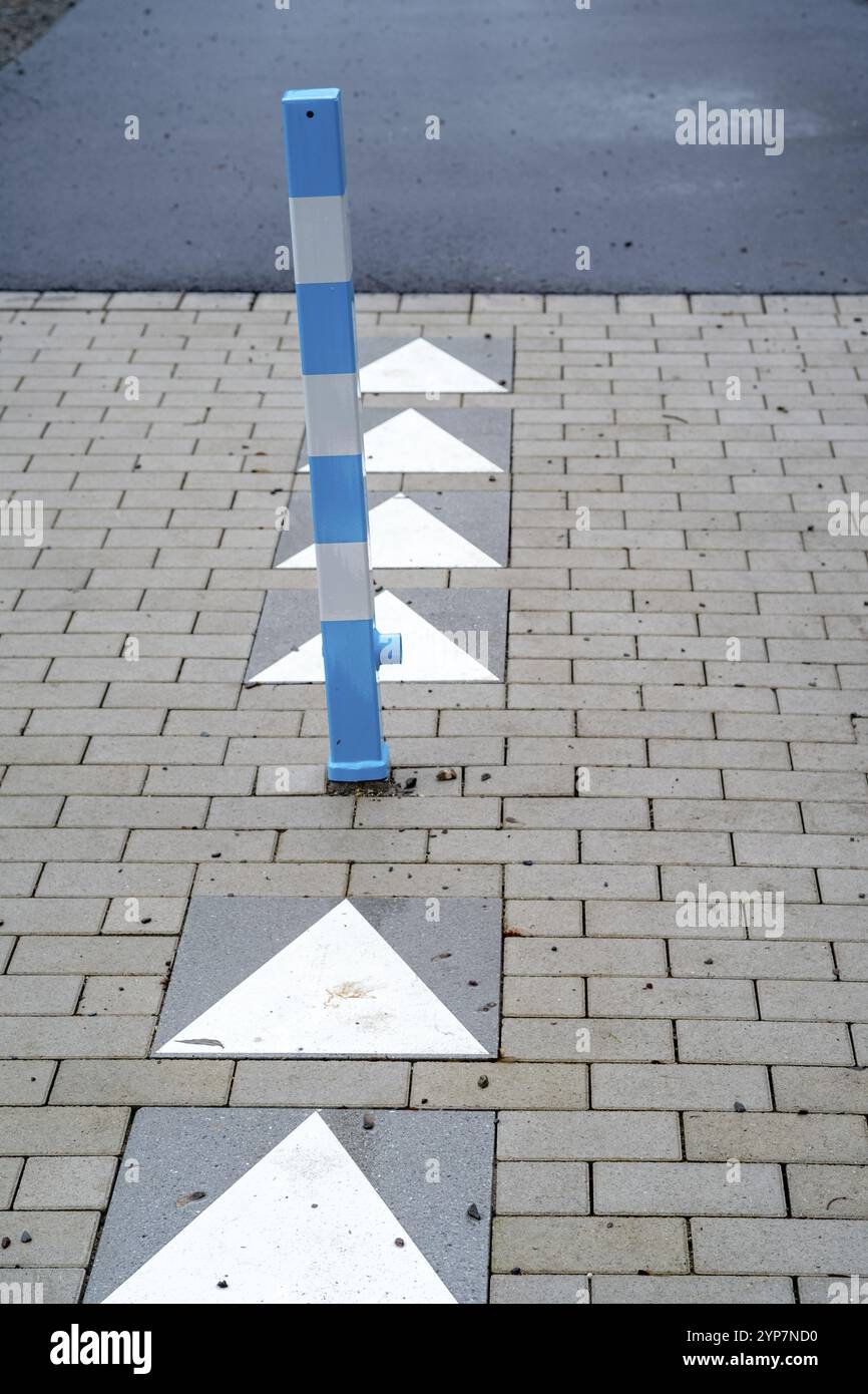 Cycle path with pole and sign on the ground Stock Photo - Alamy